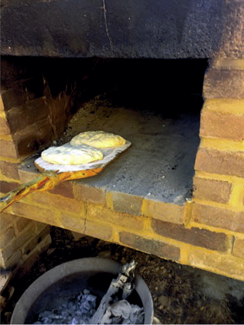Beehive-styled bake oven ready for firing at Old Stone House Christmas ...