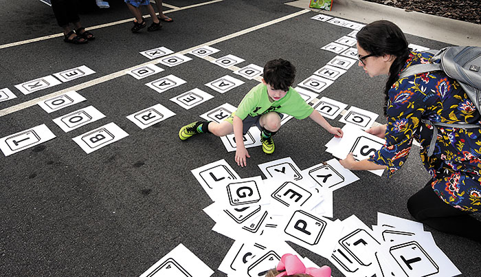 Students enjoy free reads and fun at Mission Possible literacy event ...