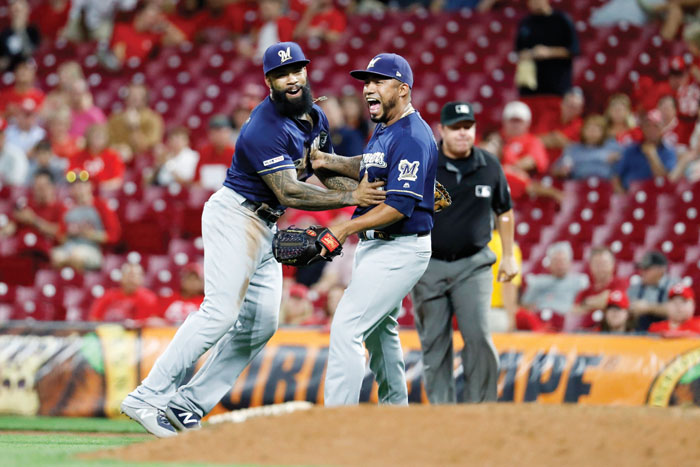 Surging Brewers clinch playoff berth with win over Reds | Salisbury Post