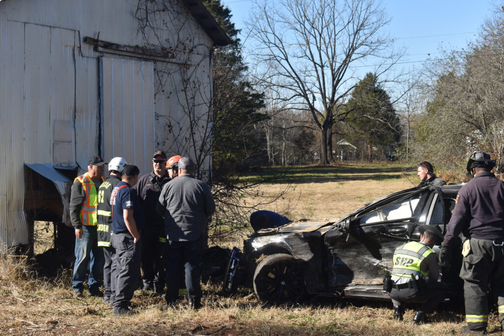 One person hospitalized after vehicle collision, being trapped under ...